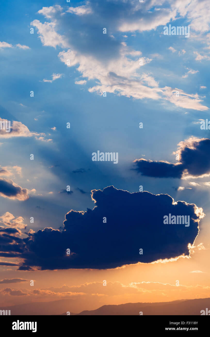 Sky with sun behind the clouds at sunset Stock Photo - Alamy
