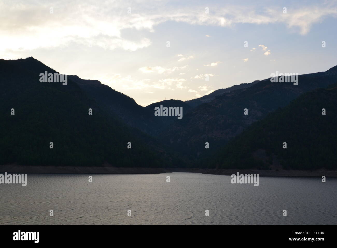 Sunset behind the mountain and lake view Stock Photo - Alamy