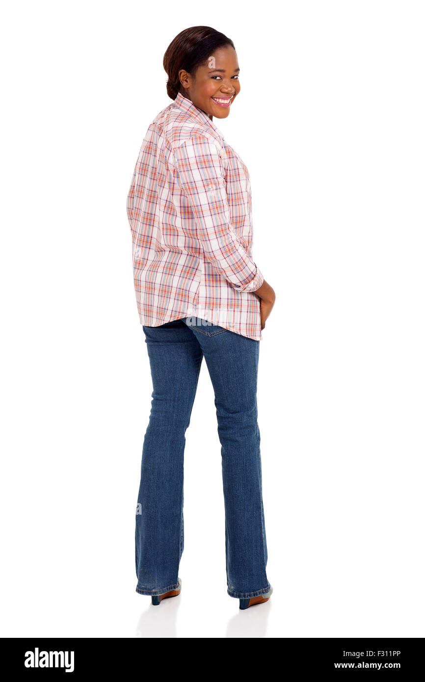 beautiful young African woman looking back on white background Stock ...