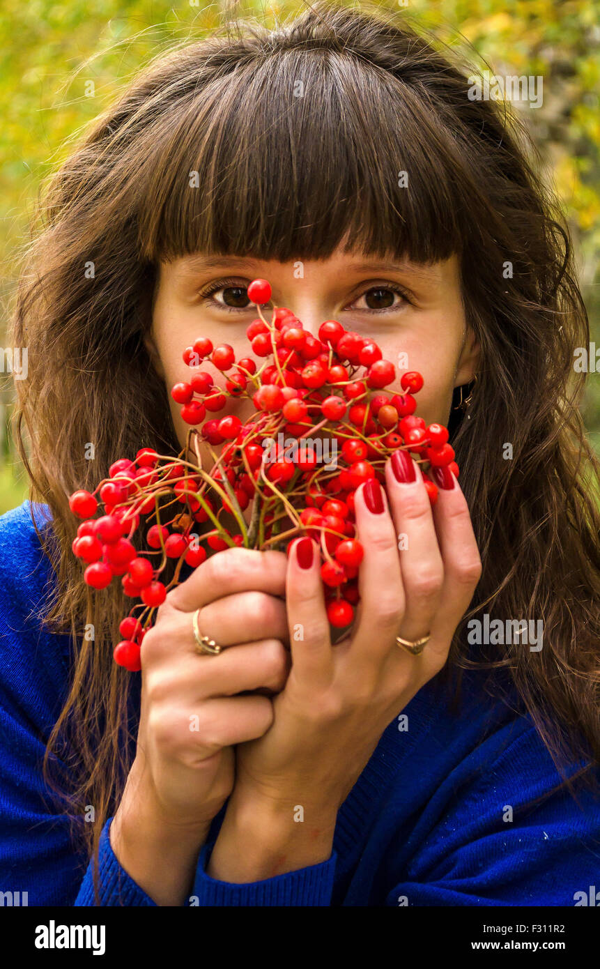 girl holding autumn berries Stock Photo - Alamy
