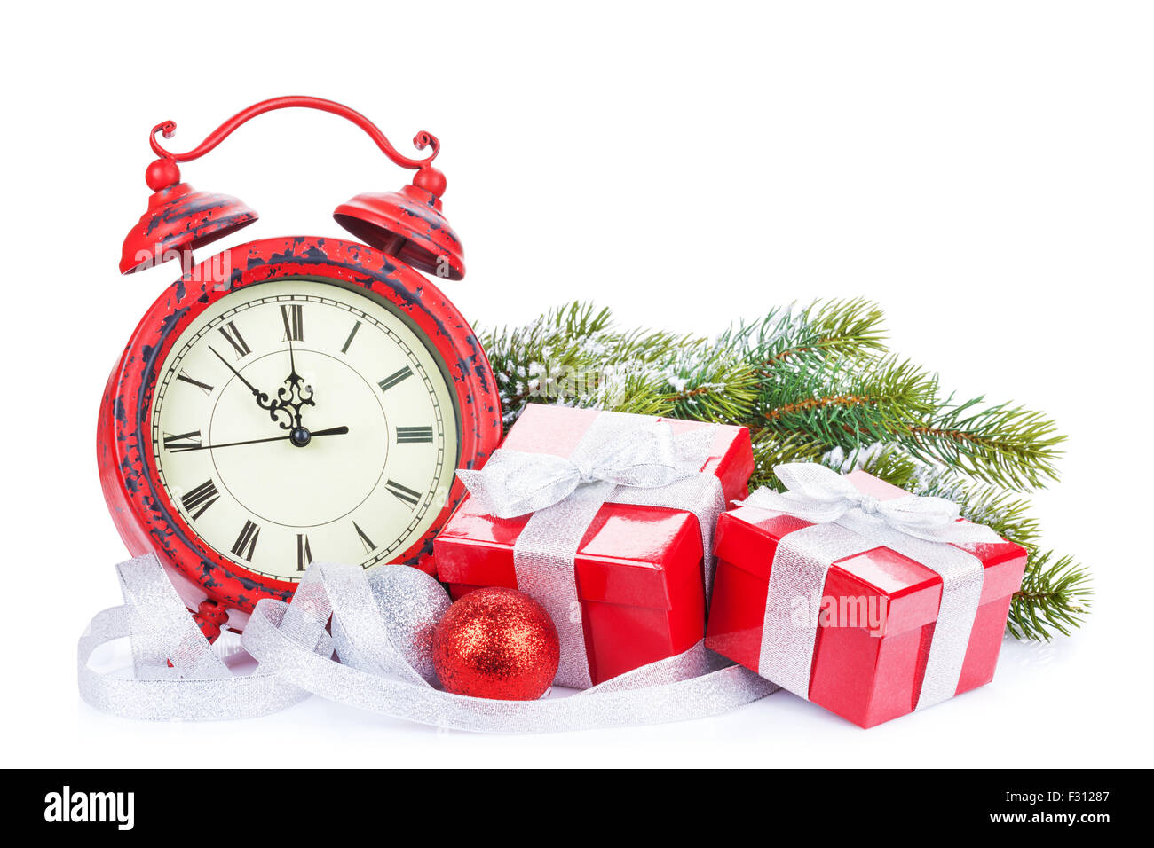 Christmas clock, gift boxes and snow fir tree. Isolated on white ...
