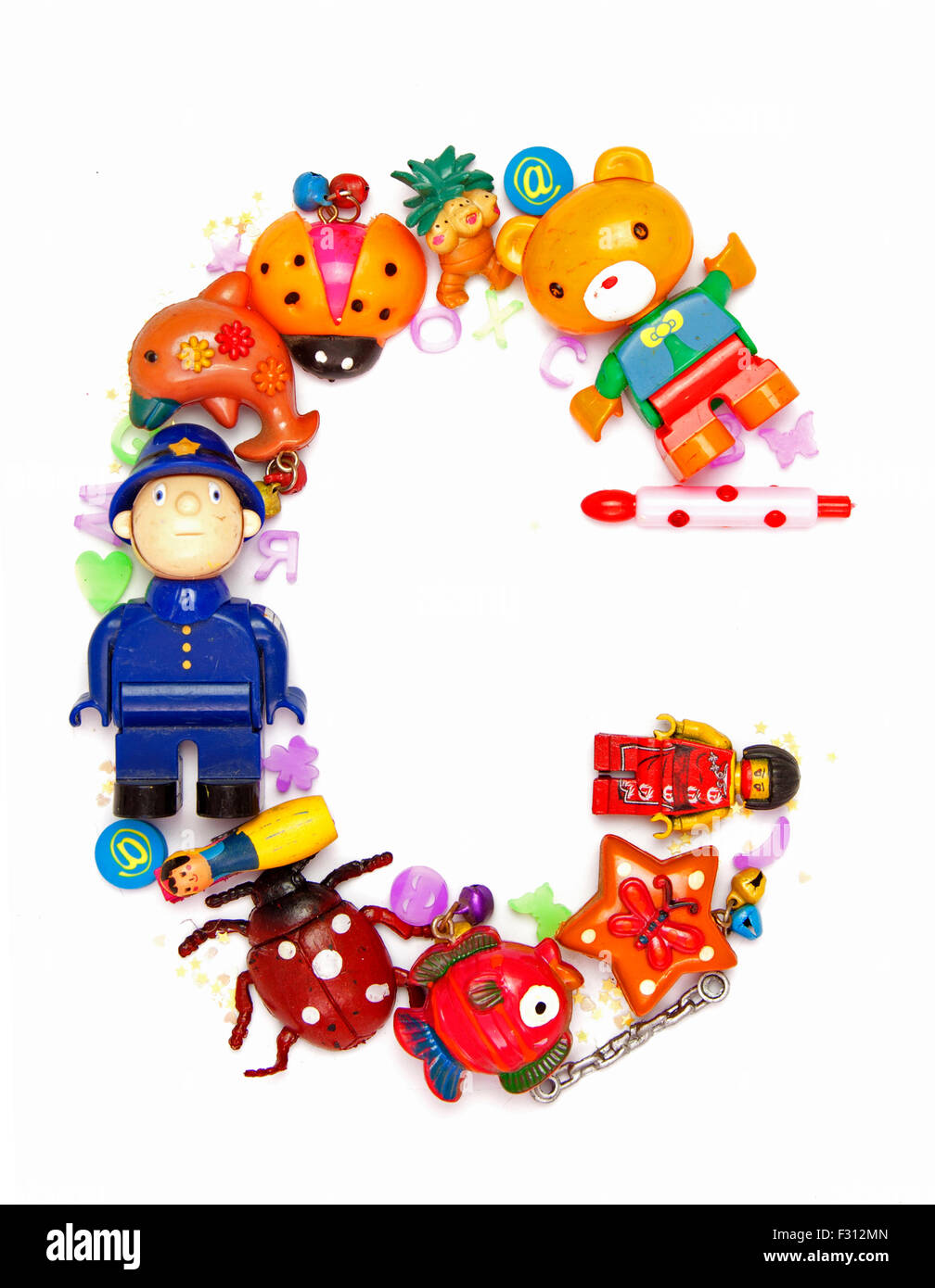 the letter C made from lots of old small toys Stock Photo - Alamy