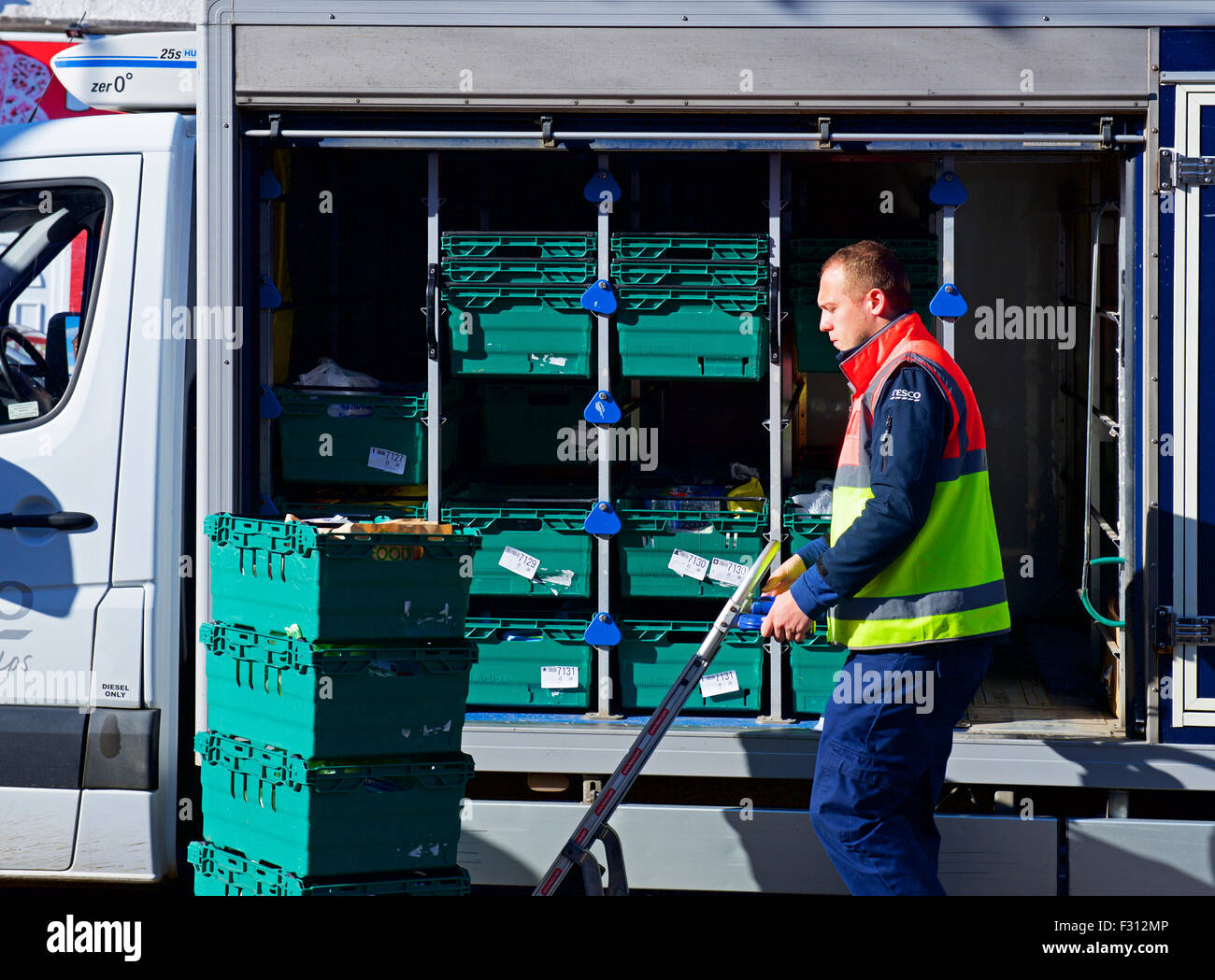 Man unloading produce from Tesco delivery van, England UK Stock Photo ...