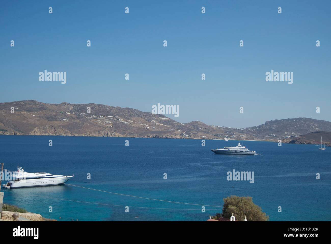 Greek island clear blue water Mykonos travel sea Stock Photo - Alamy