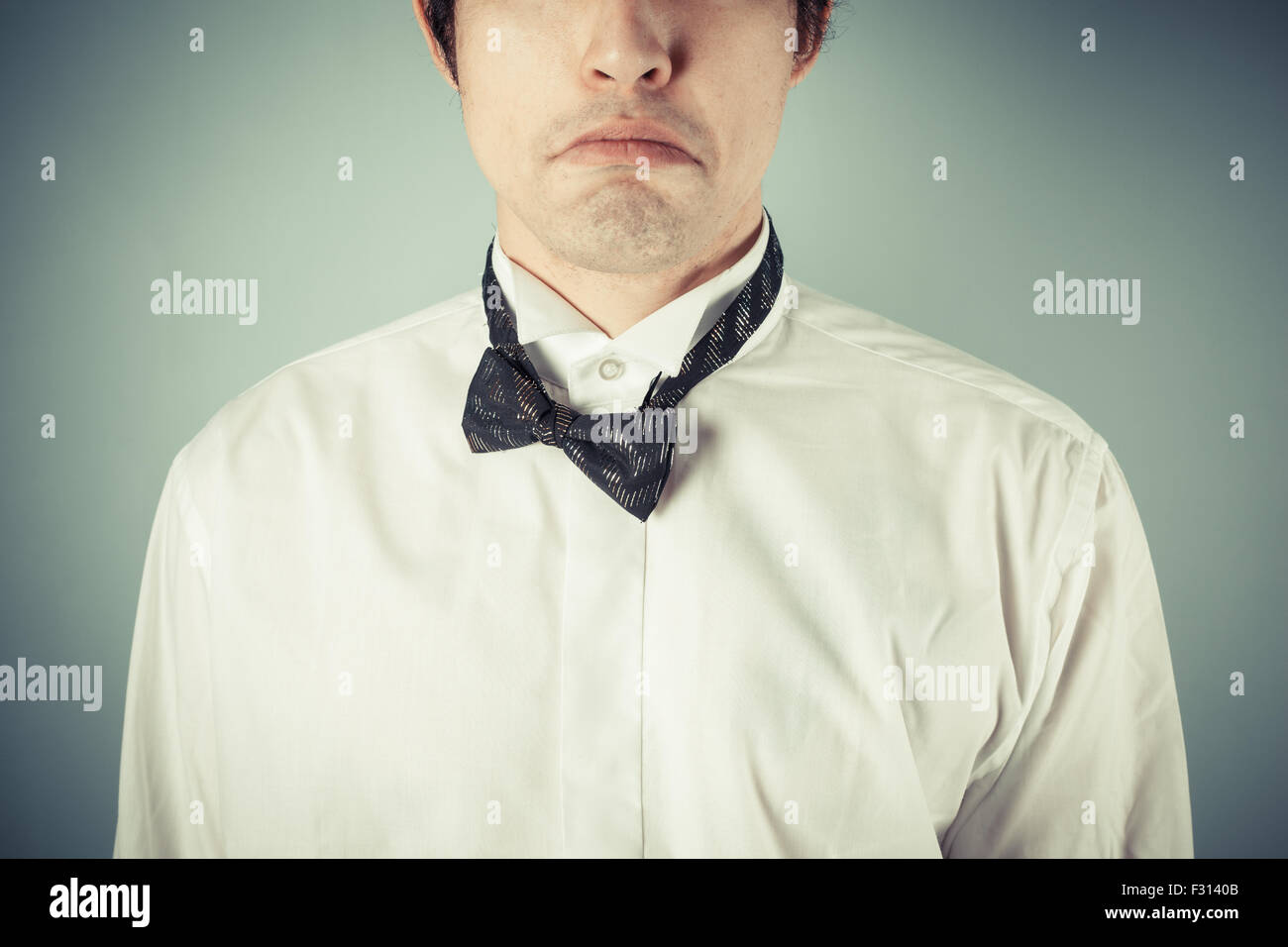 Young sad man wearing hi-res stock photography and images - Alamy