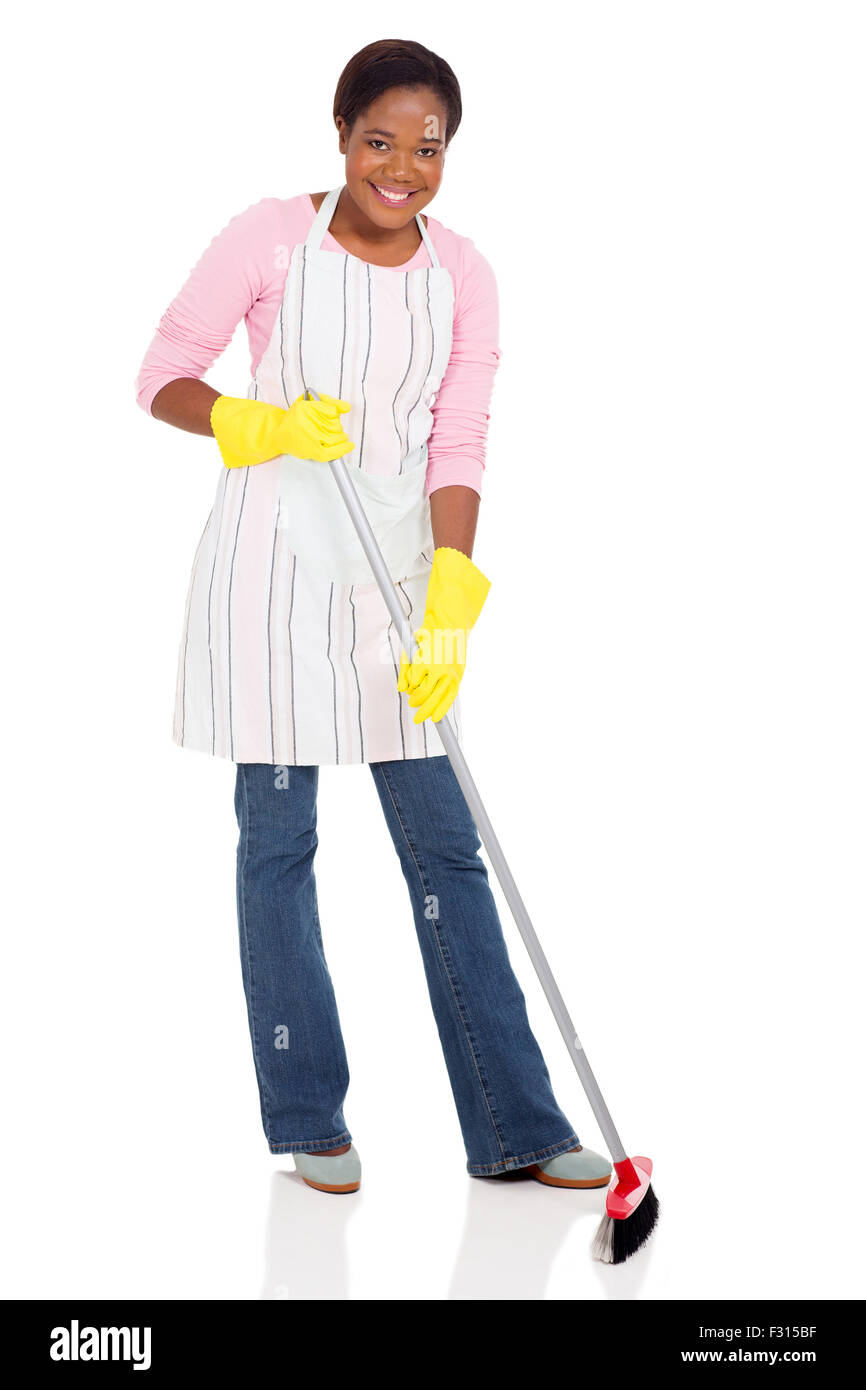 beautiful young African woman sweeping on white background Stock Photo ...