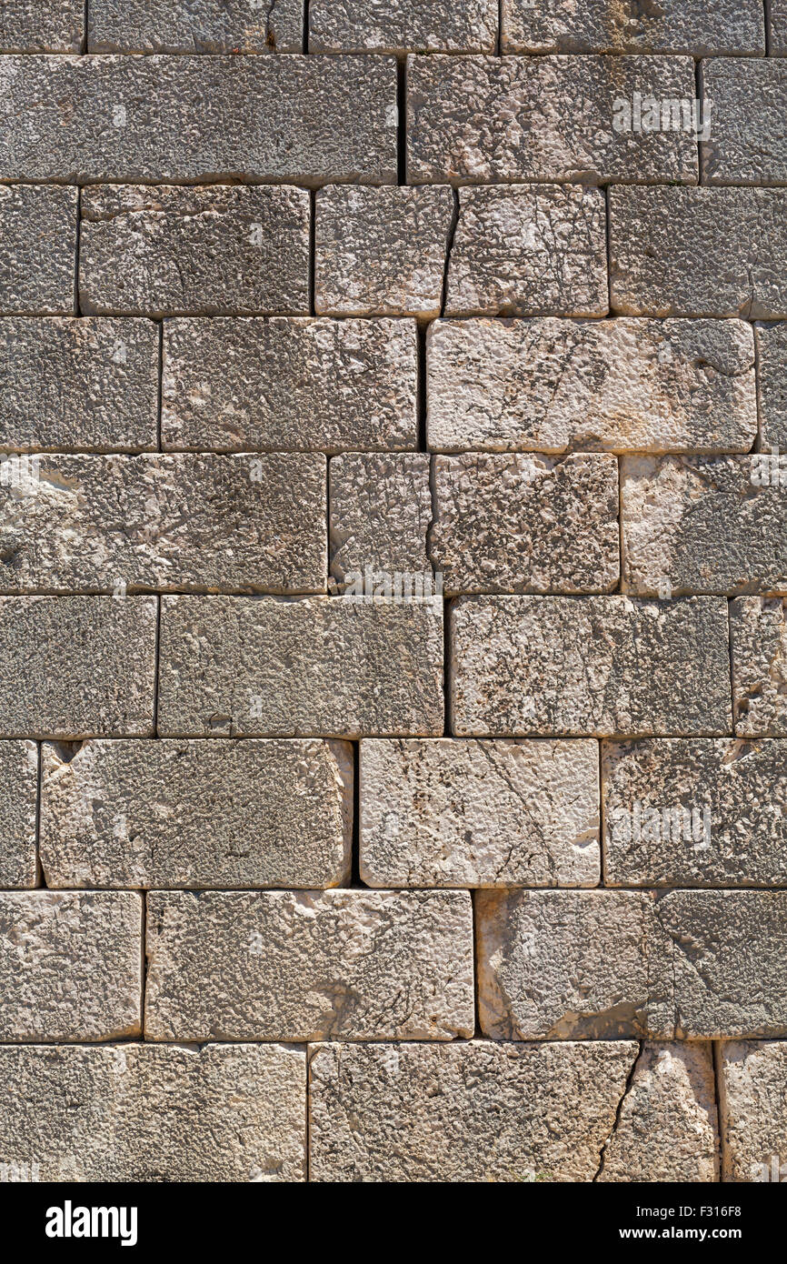 Natural old stone wall texture ancient ruin wall Stock Photo - Alamy