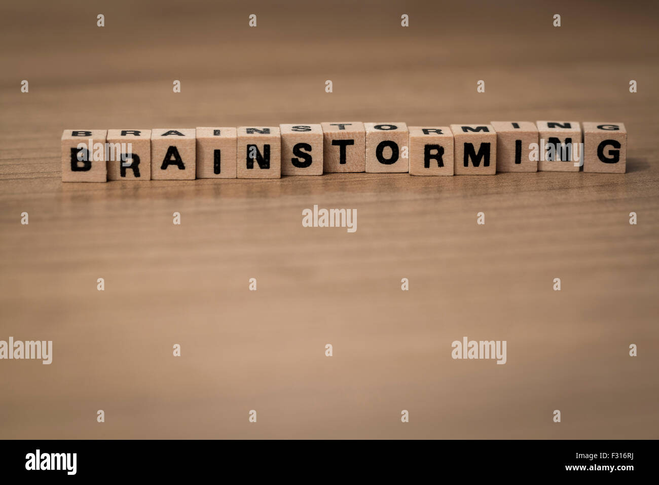 Brainstorming written in wooden cubes on a desk Stock Photo - Alamy