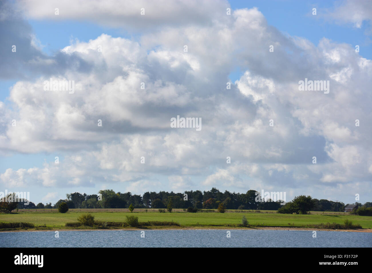 Countryside landscape scene with clouds in sky Stock Photo - Alamy