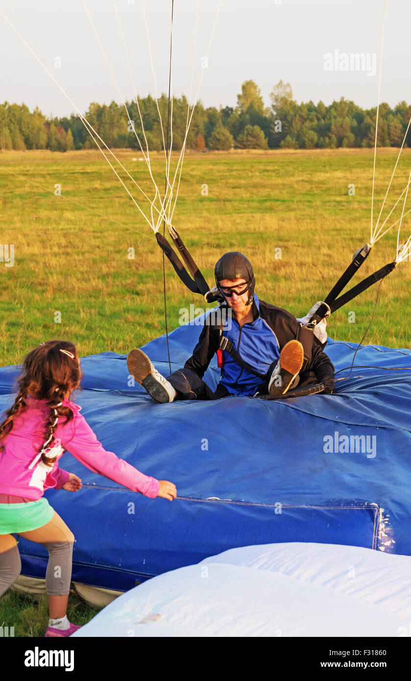 Parachutists - 2014. The skydiver landing under parachute Stock Photo ...