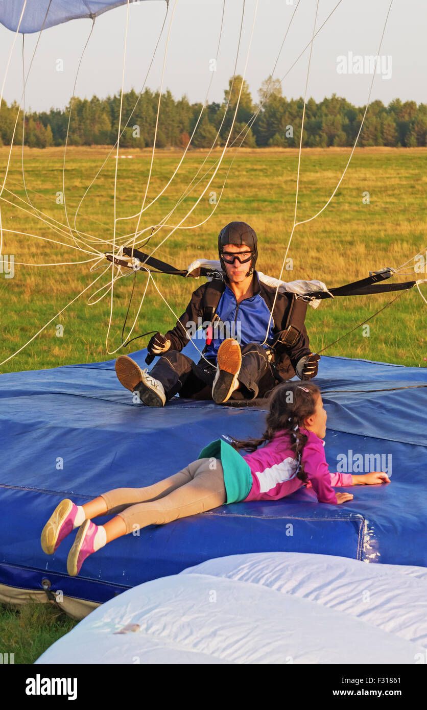 Parachutists - 2014. The skydiver landing under parachute Stock Photo ...