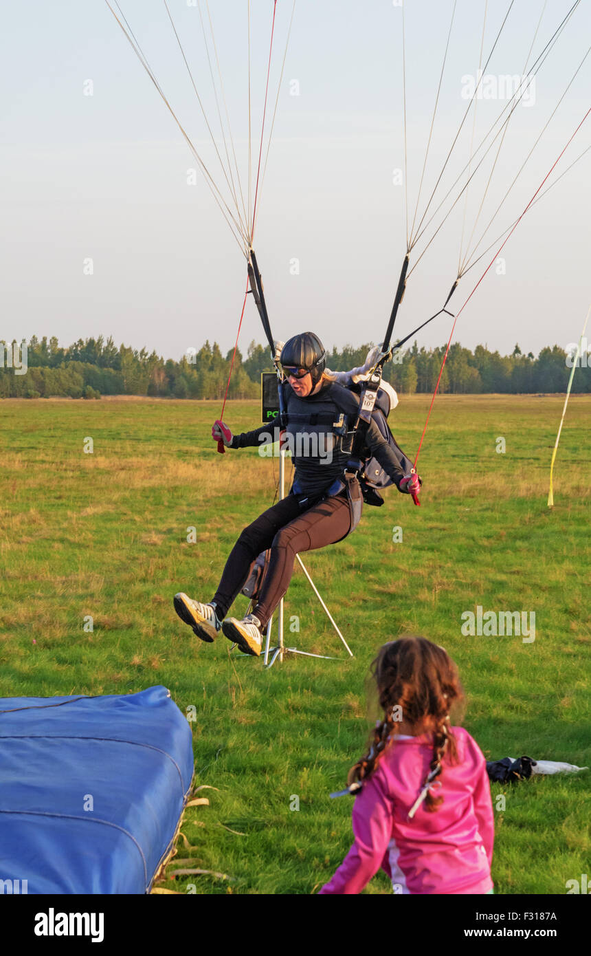 Female parachute jumper landing hi-res stock photography and images - Alamy