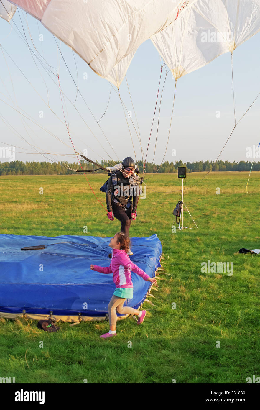 Parachutists - 2014. The skydiver landing under parachute Stock Photo ...