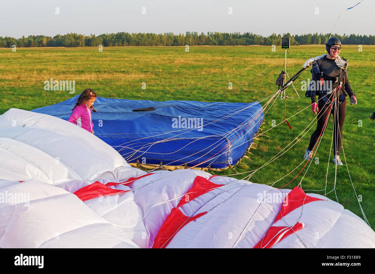 Parachutists - 2014. The skydiver landing under parachute Stock Photo ...