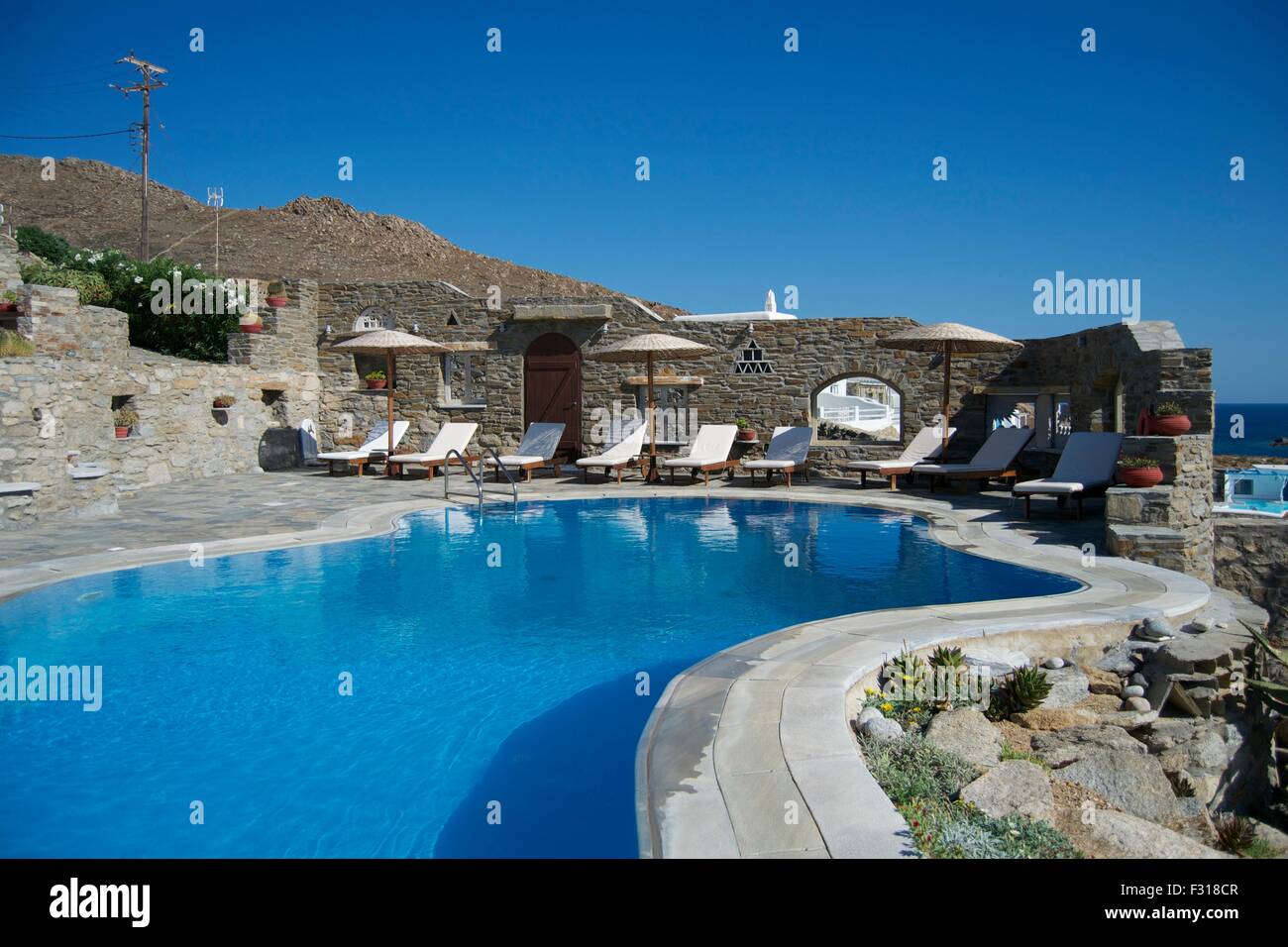 Beach facing swimming pool resort relax sea blue Stock Photo - Alamy