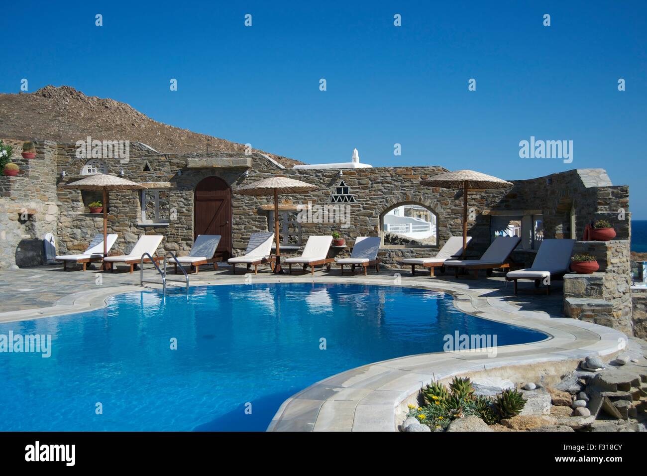 Beach facing swimming pool resort relax sea blue Stock Photo - Alamy
