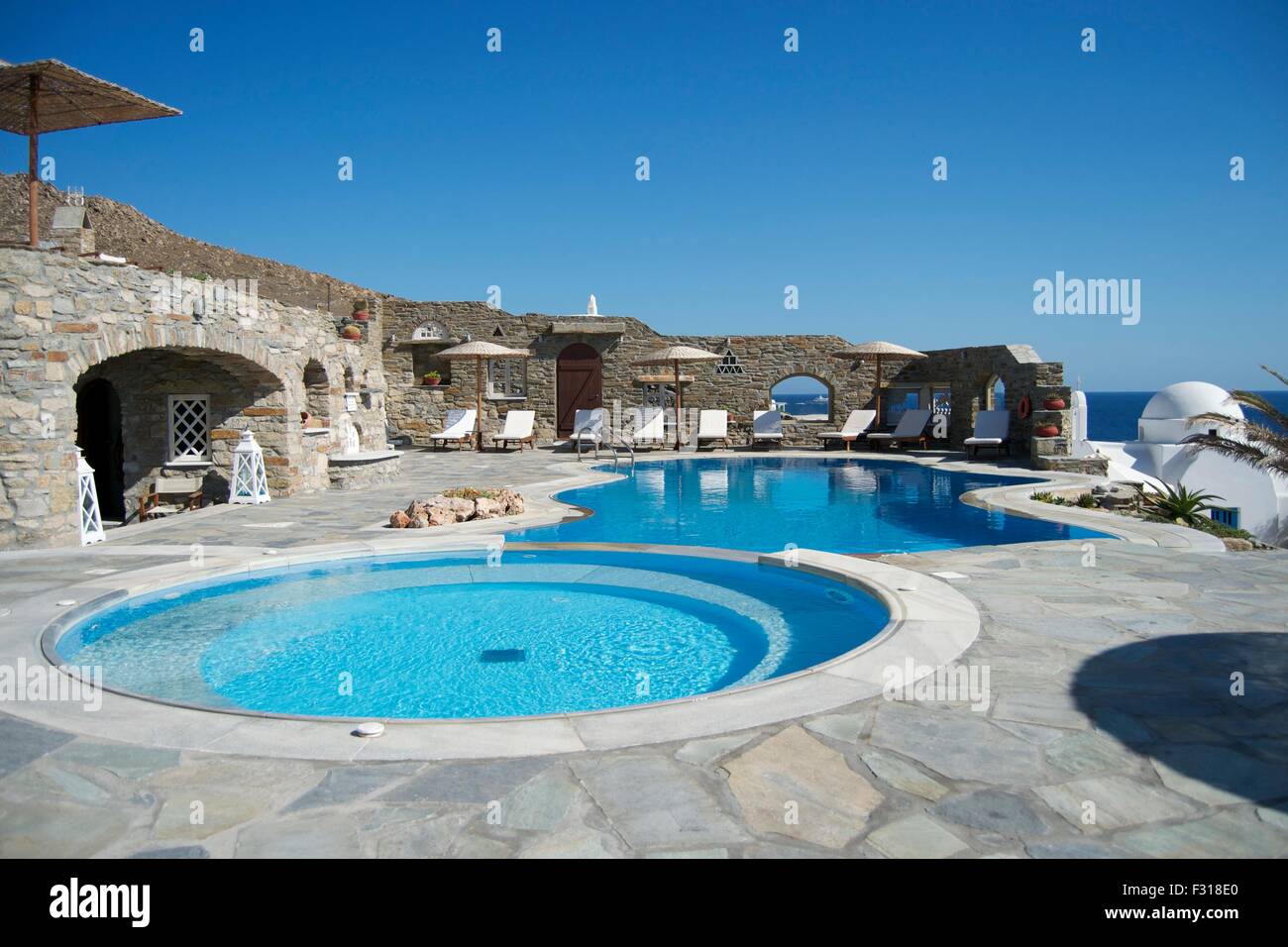 Beach facing swimming pool resort relax sea blue Stock Photo - Alamy