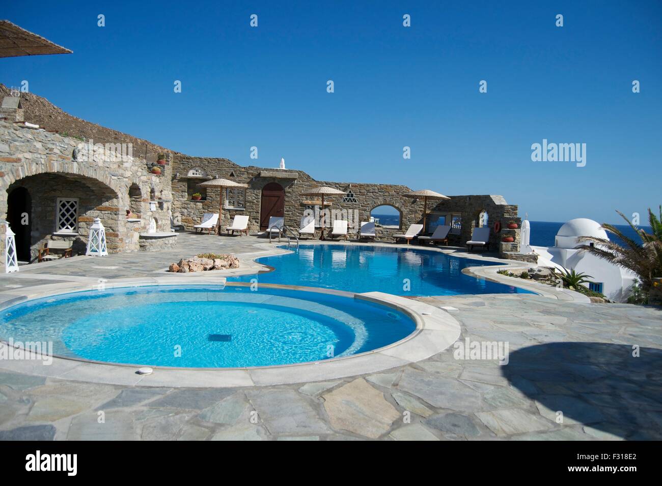 Beach facing swimming pool resort relax sea blue Stock Photo - Alamy