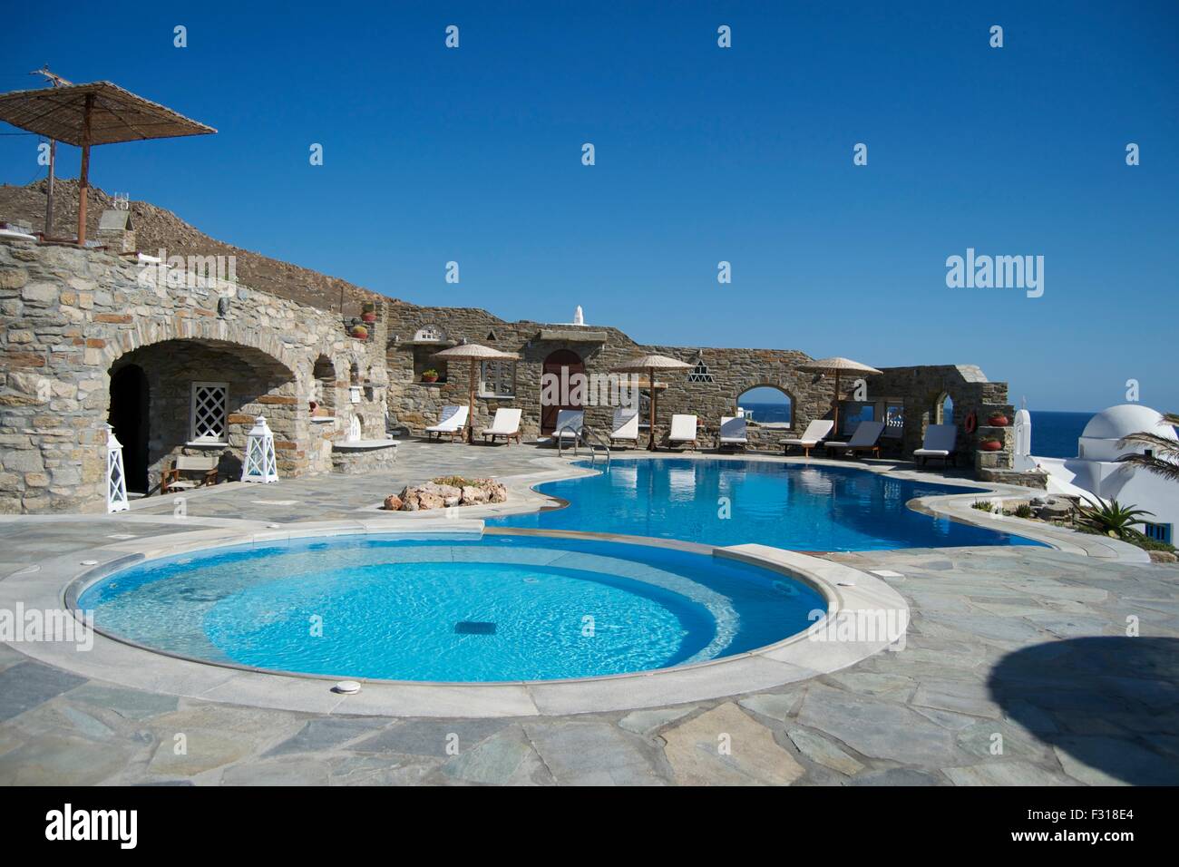 Beach facing swimming pool resort relax sea blue Stock Photo - Alamy
