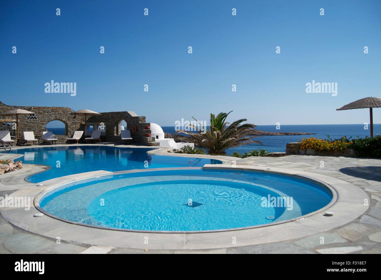 Beach facing swimming pool resort relax sea blue Stock Photo - Alamy