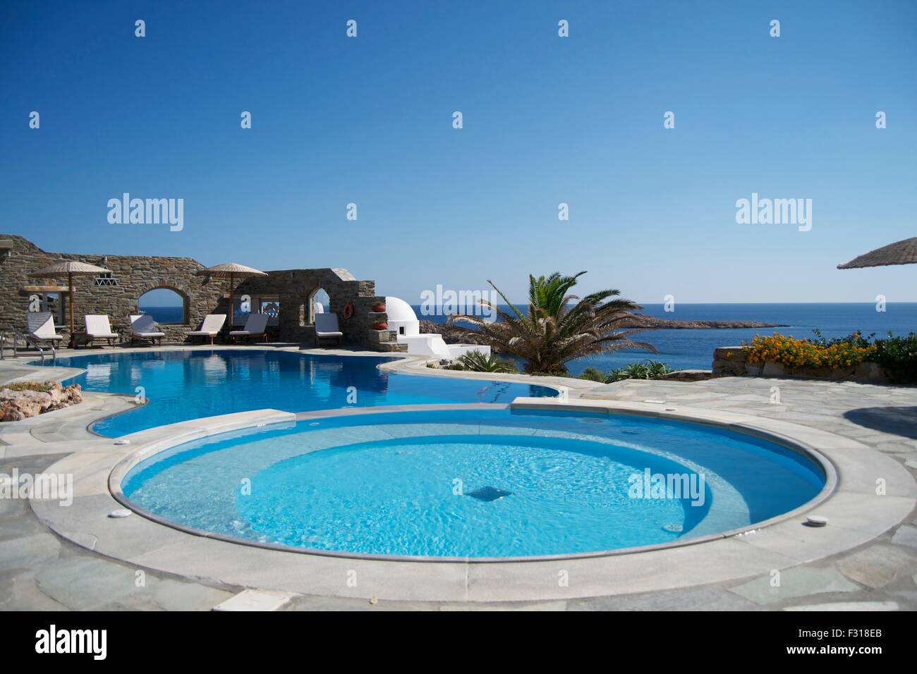 Beach facing swimming pool resort relax sea blue Stock Photo - Alamy