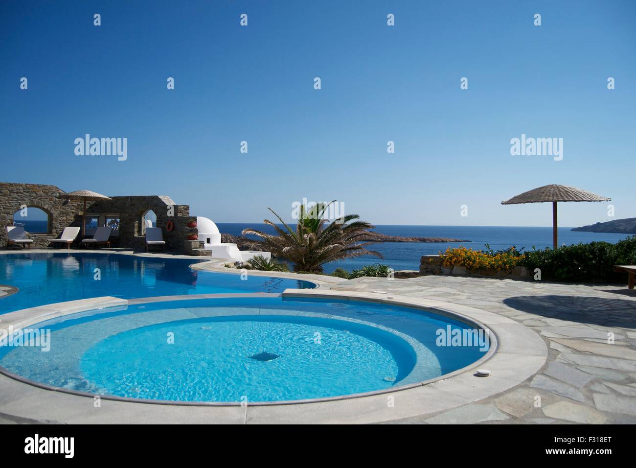 Beach facing swimming pool resort relax sea blue Stock Photo - Alamy