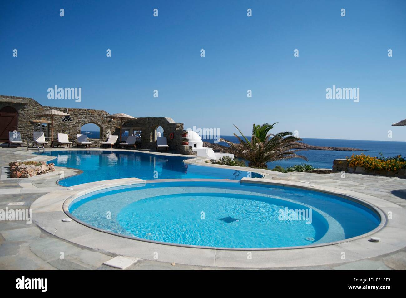 Beach facing swimming pool resort relax sea blue Stock Photo - Alamy