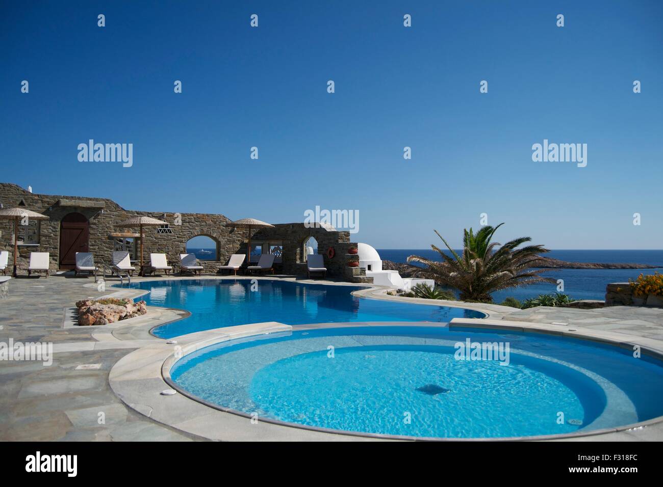 Beach facing swimming pool resort relax sea blue Stock Photo - Alamy