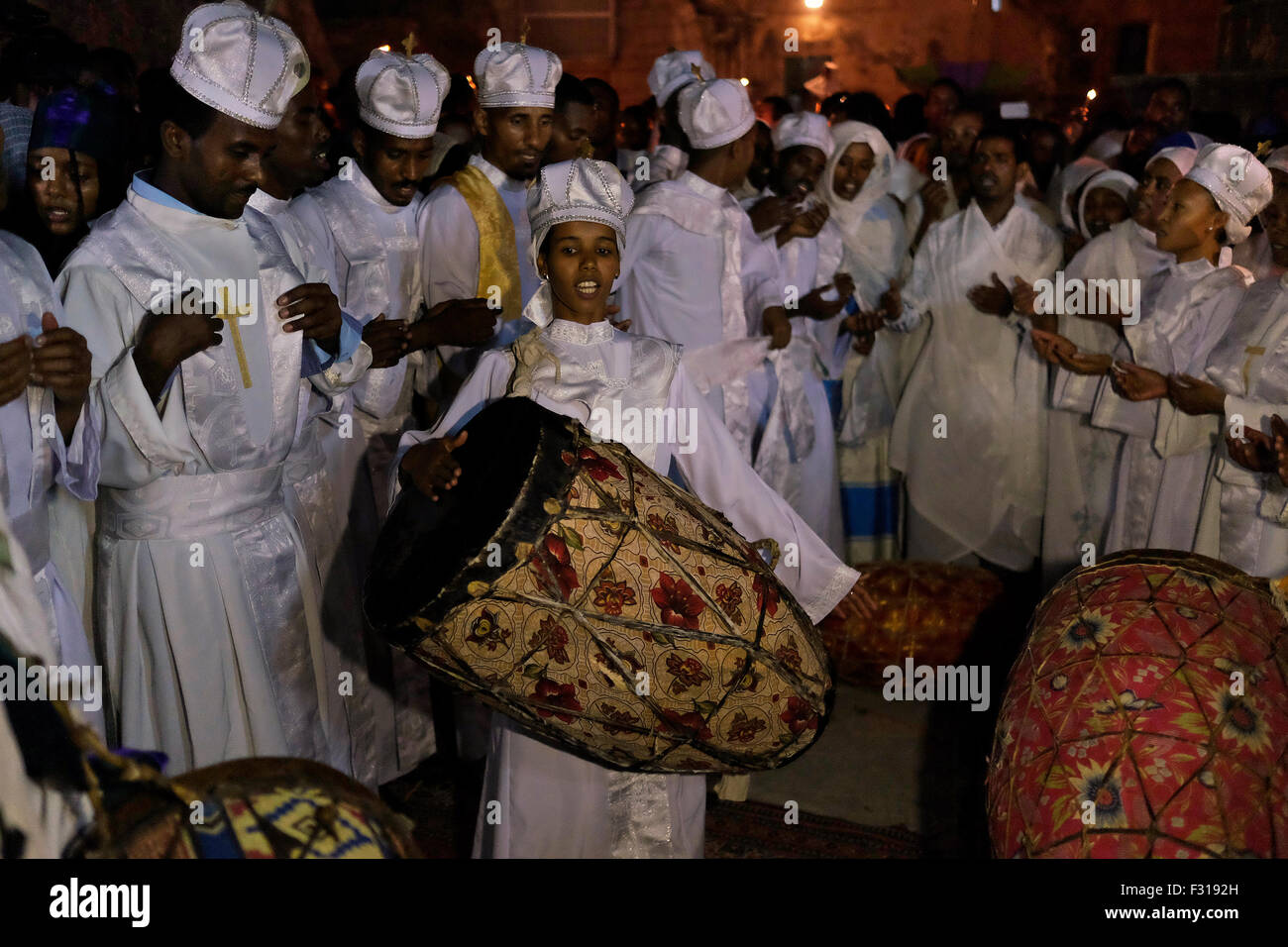 Ethiopian Orthodox Christians play the Kebero a double-headed, conical ...