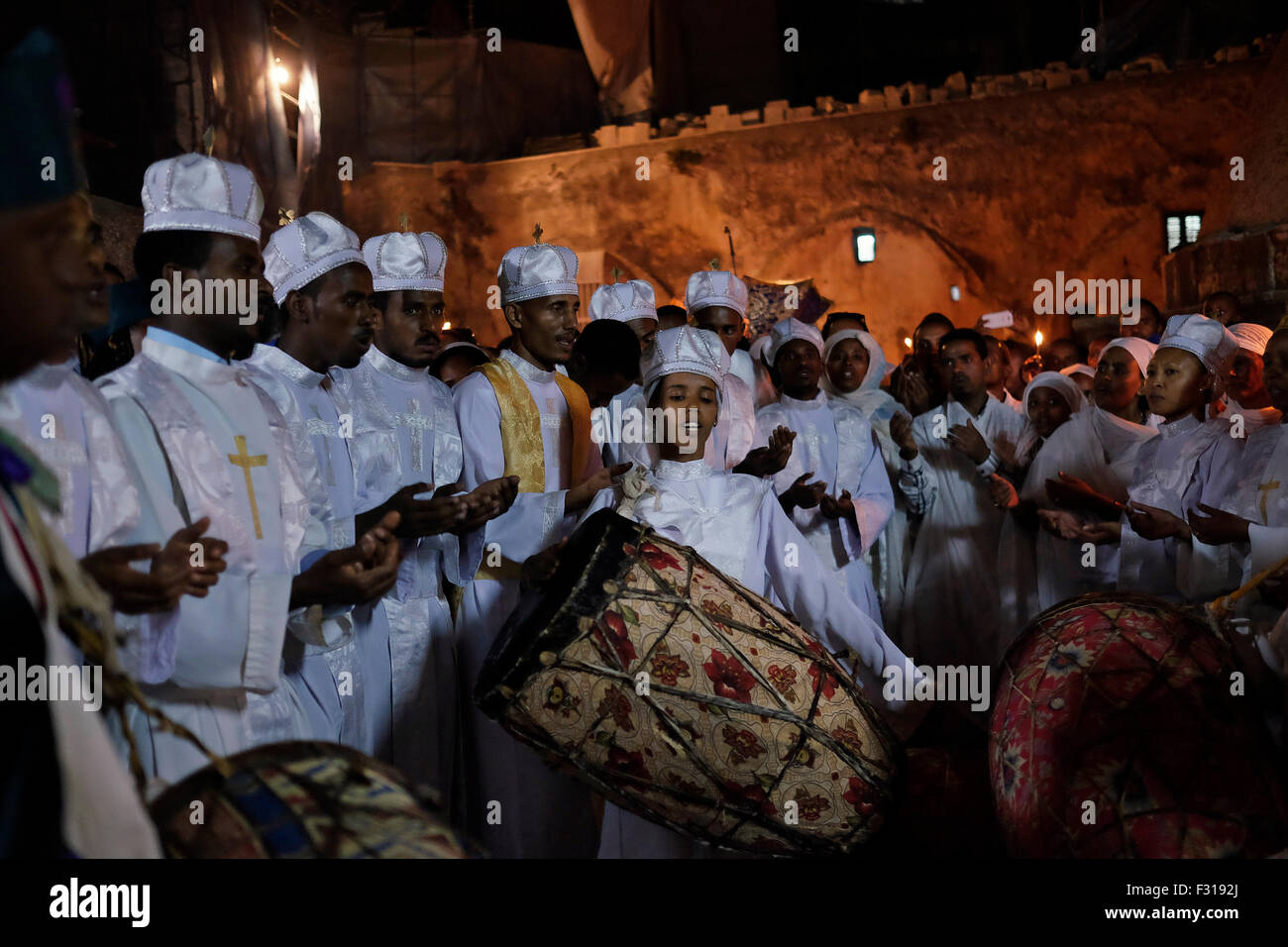 Ethiopian Orthodox Christians play the Kebero a double-headed, conical ...