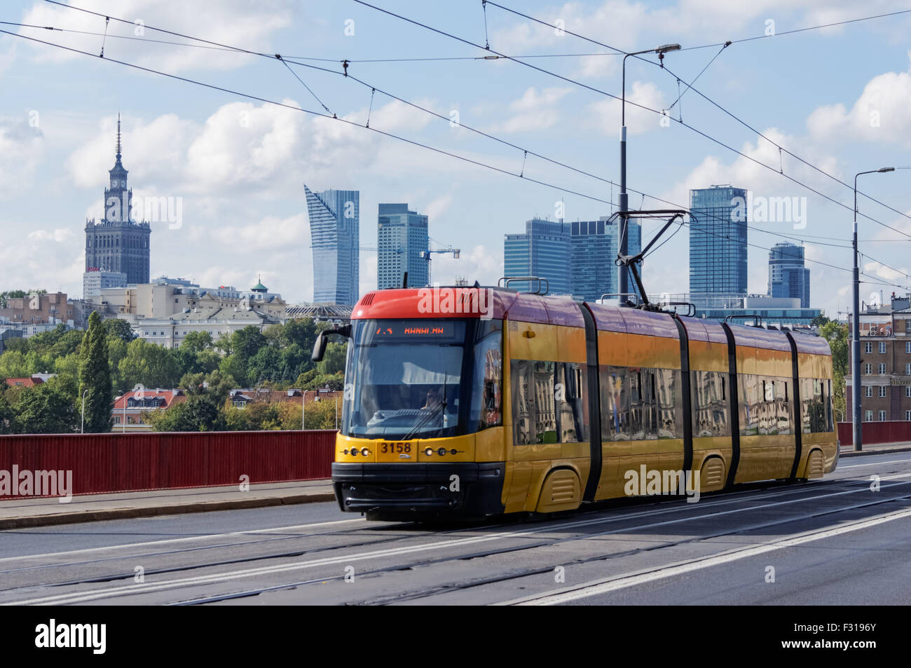 Modern tram on Śląsko-Dąbrowski Bridge over the Vistula River with ...
