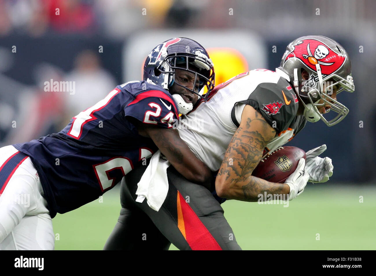 SEP 27 2015: Houston Texans cornerback Johnathan Joseph (24) tackles ...