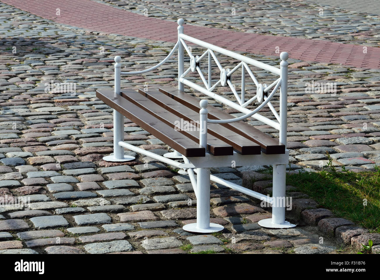 Modern white metal Park bench close up Stock Photo - Alamy