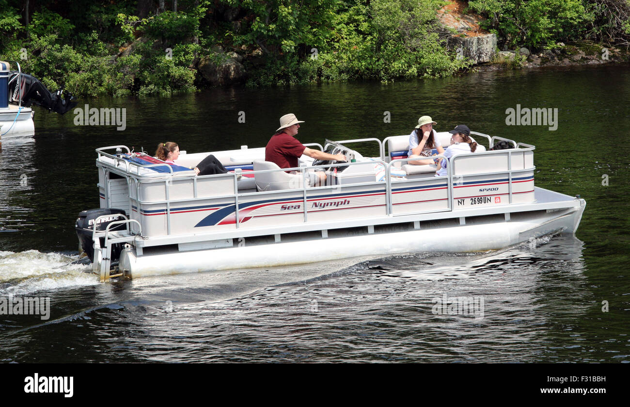 Pontoon deck boat with family friends people on board. Long Lake New ...