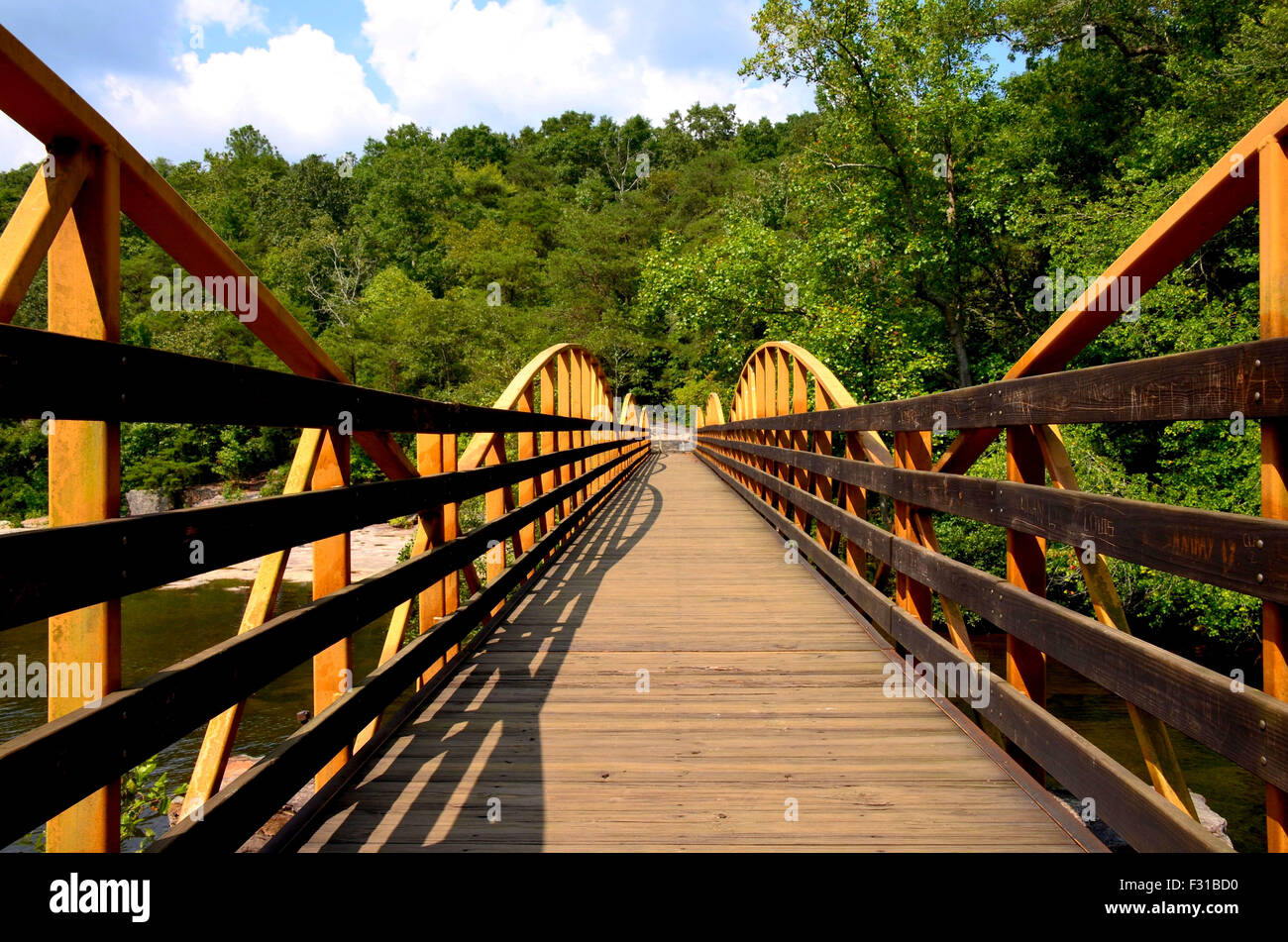 Walking bridge over river Stock Photo - Alamy