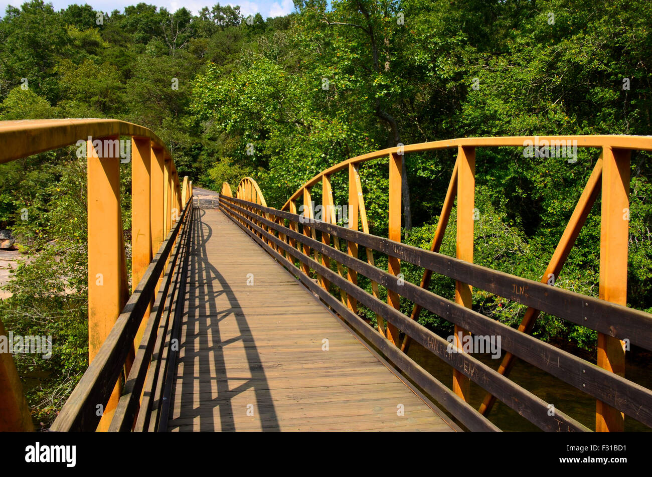 Walking bridge over river Stock Photo - Alamy