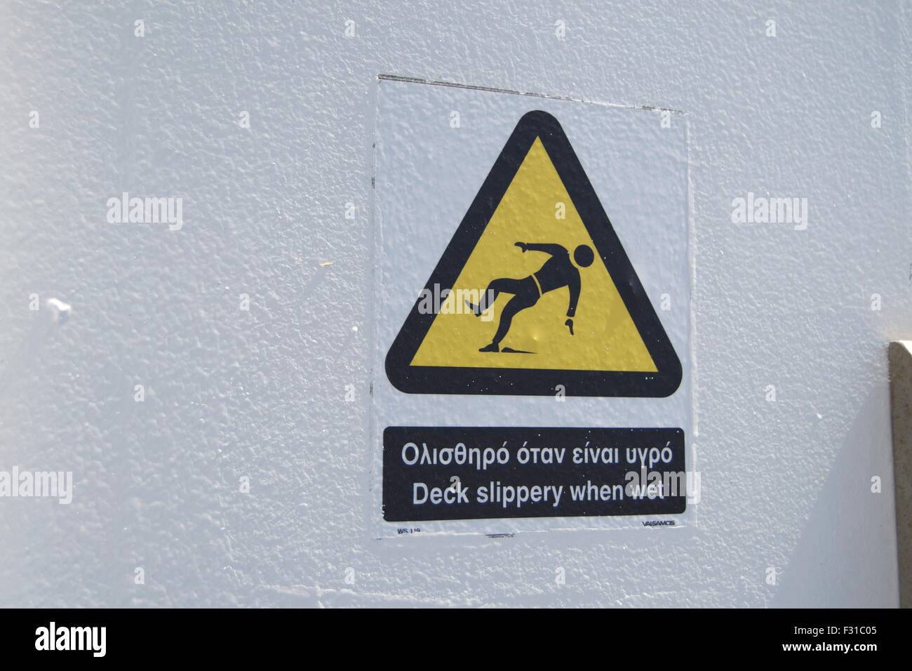 Caution warning sign slippery deck dangerous wet Stock Photo - Alamy