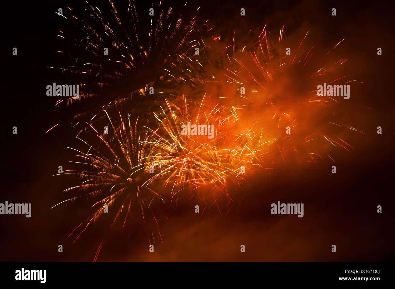Beautiful orange fireworks on the night sky Stock Photo - Alamy