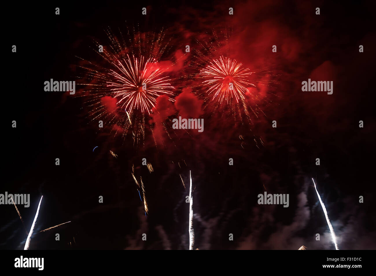 Beautiful red fireworks on the night sky Stock Photo - Alamy