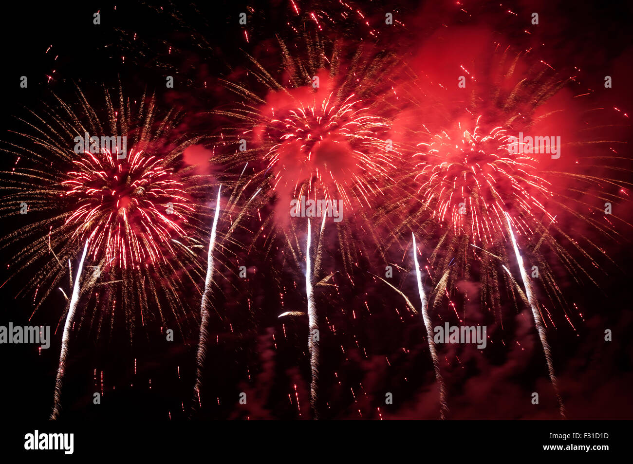 Beautiful red fireworks on the night sky Stock Photo - Alamy