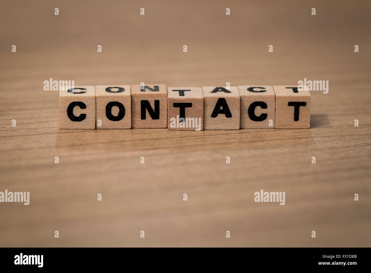 Contact written in wooden cubes on a desk Stock Photo - Alamy