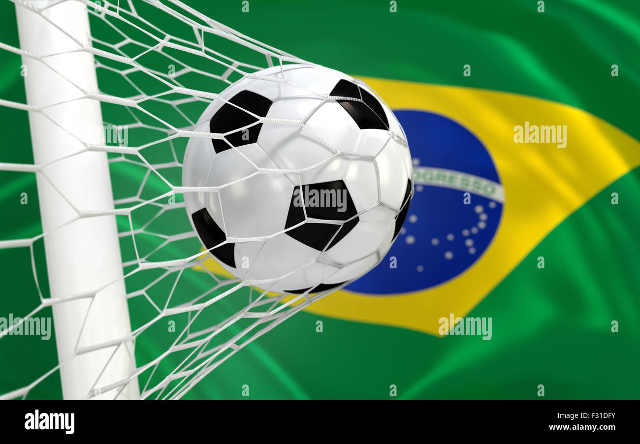 Brazil flag and soccer ball, football in goal net Stock Photo - Alamy