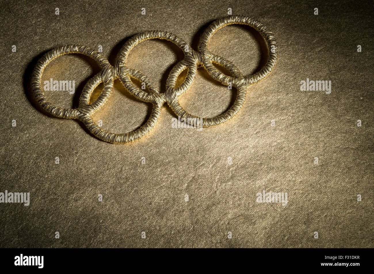 RIO DE JANEIRO, BRAZIL - FEBRUARY 3, 2015: Gold Olympic rings symbol ...