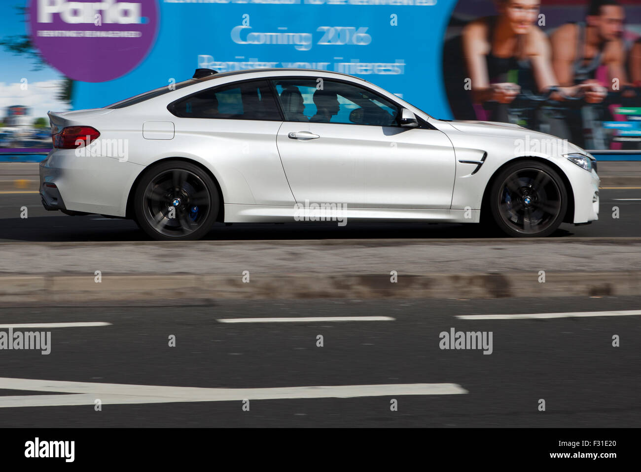 A blurred moving BMW M4 at speed motion blur on 'The Strand' at ...