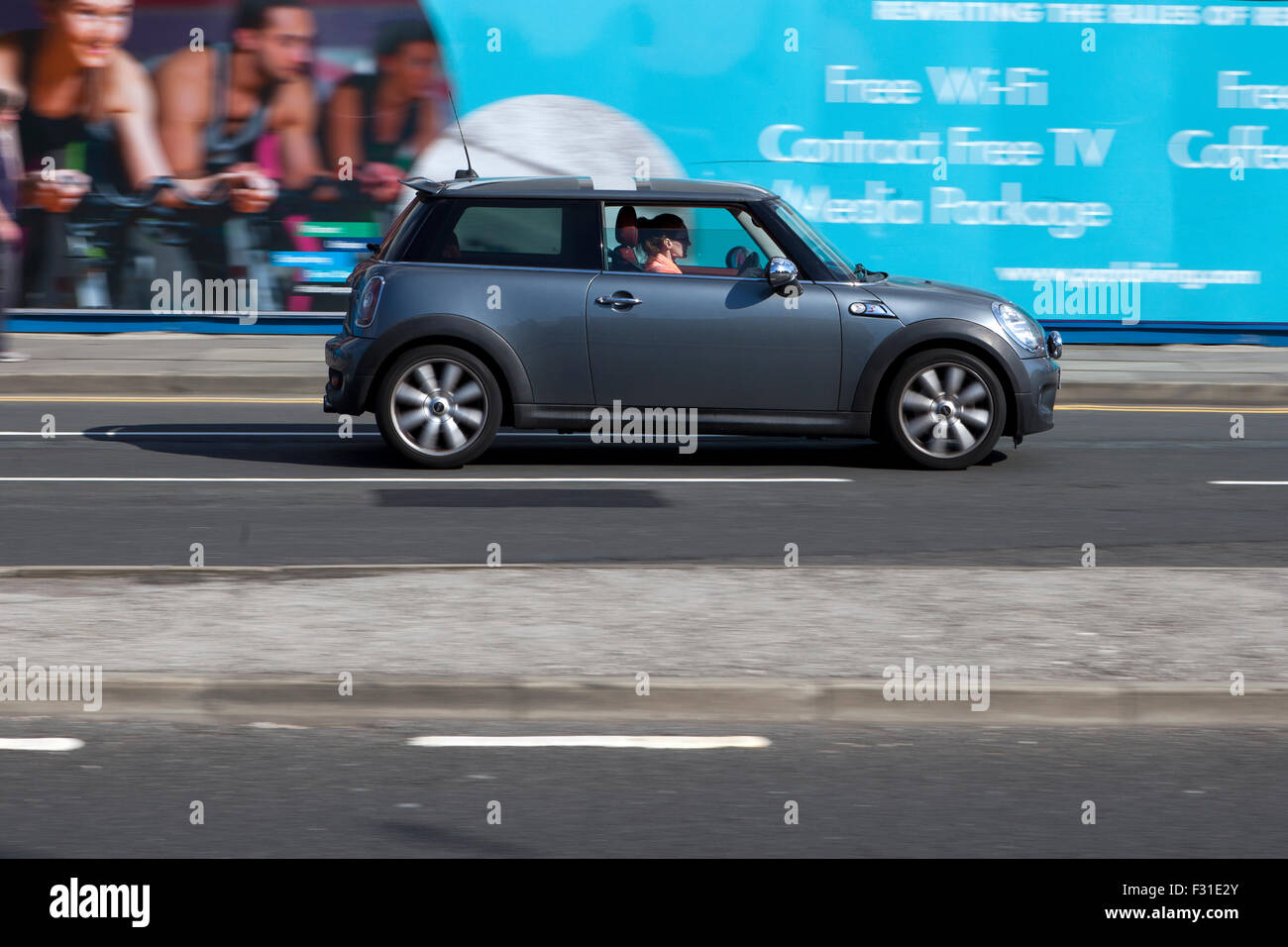 A blurred moving Mini Cooper at speed motion blur on 'The Strand' at ...