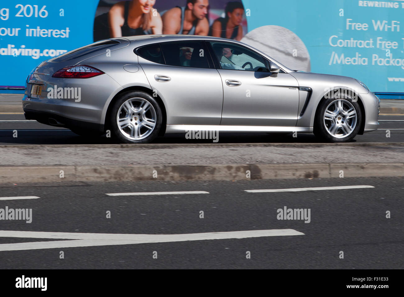 A blurred moving Porsche Panamera at speed motion blur on 'The Strand ...
