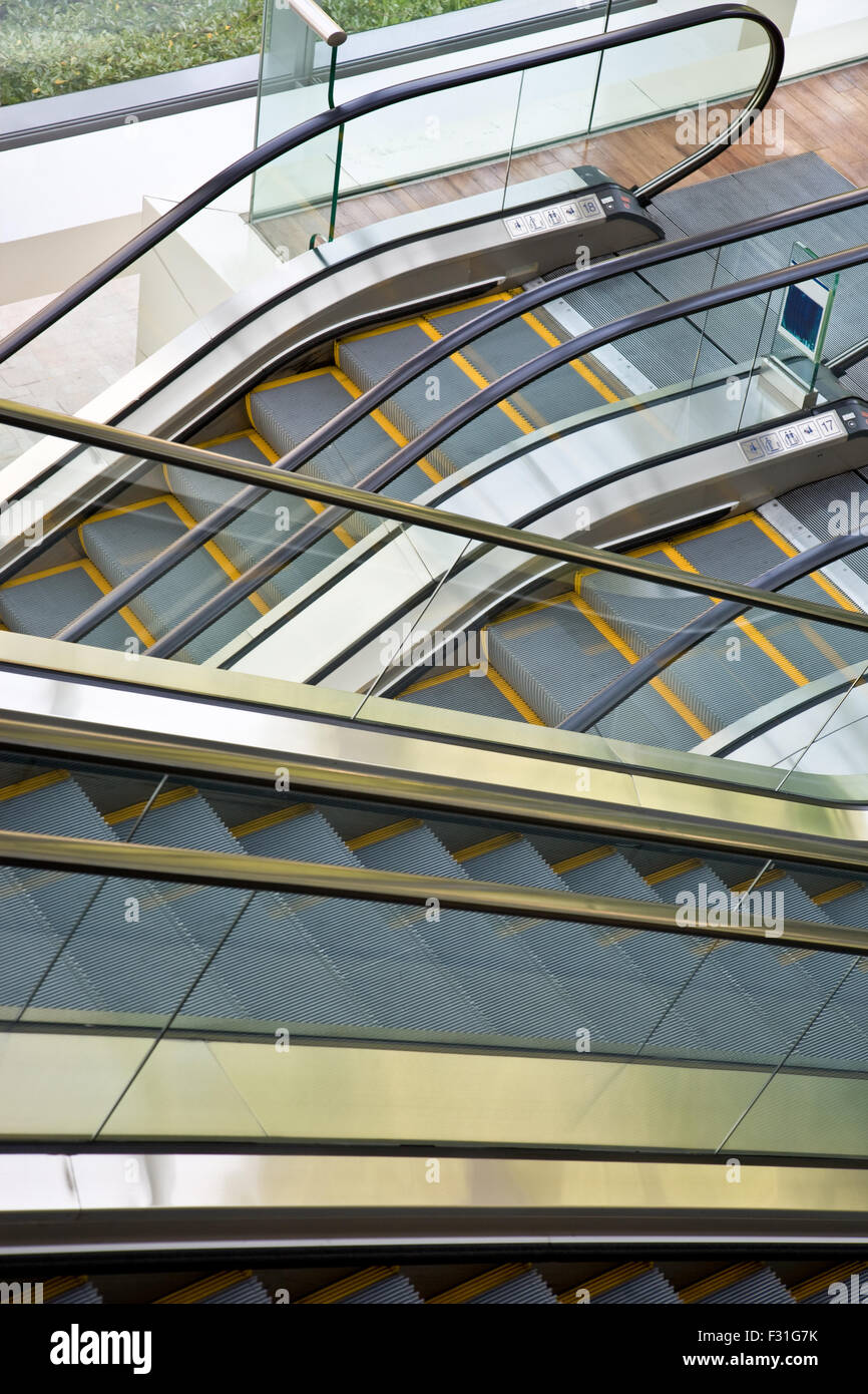 Escalators in an office building Stock Photo - Alamy