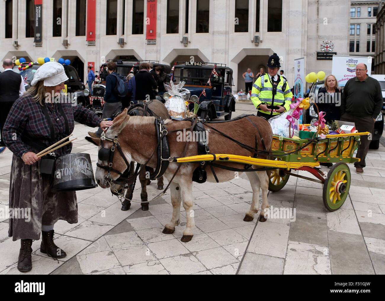 London, UK. 27th Sep, 2015. A woman dressed as costermongers of the ...