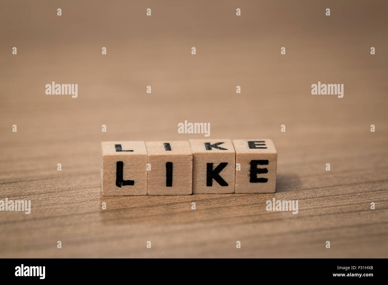 Like written in wooden cubes on a desk Stock Photo - Alamy