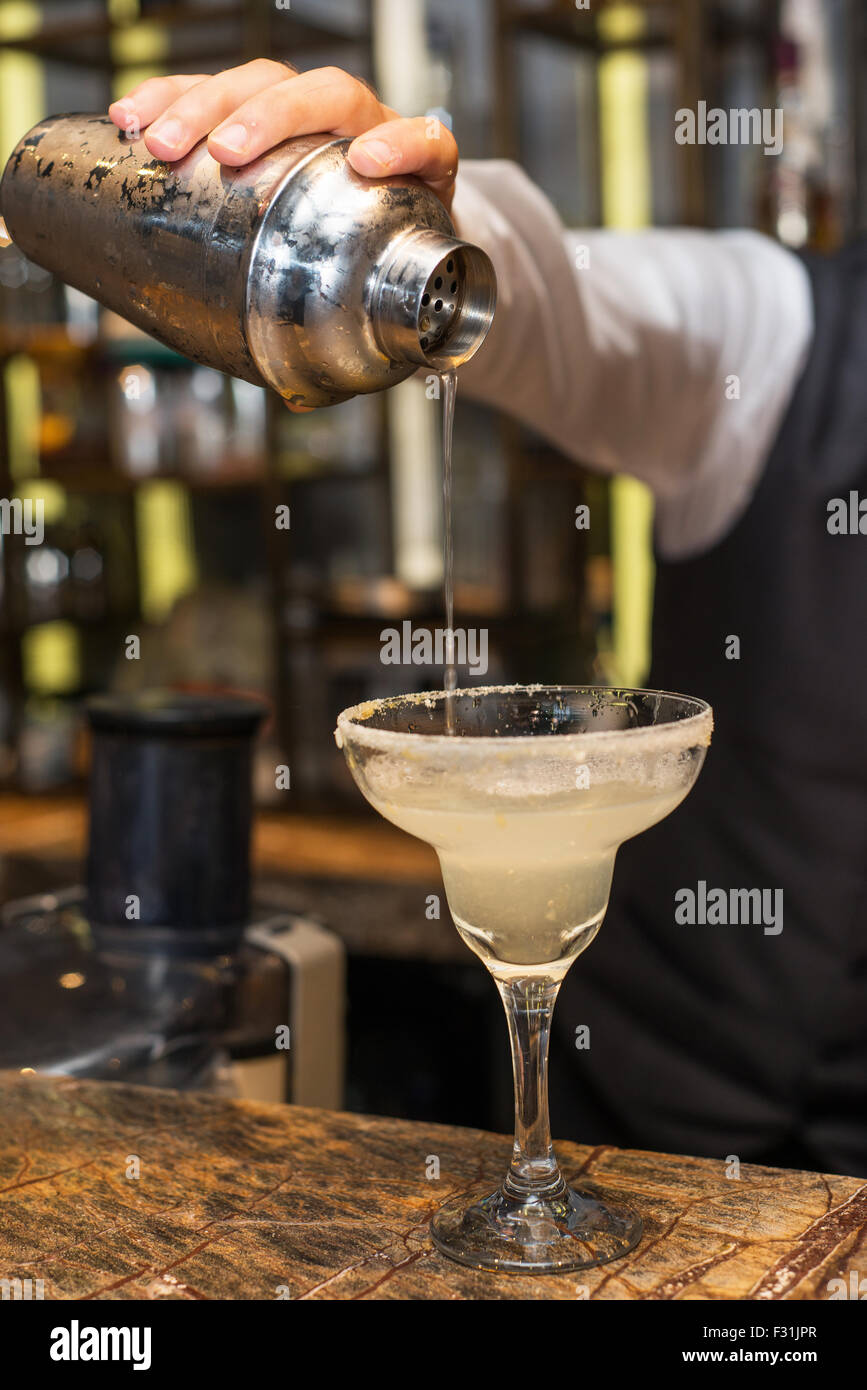 Barman Preparing and Serving A Cocktail Stock Photo - Alamy
